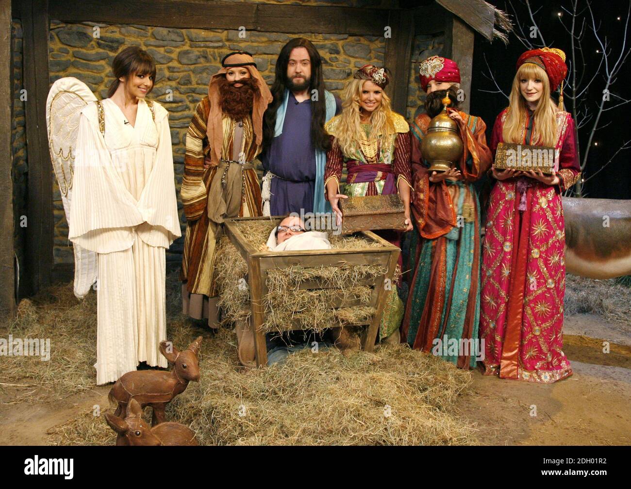 Girls Aloud with Justin Lee Collins and Alan Carr during filming a ...