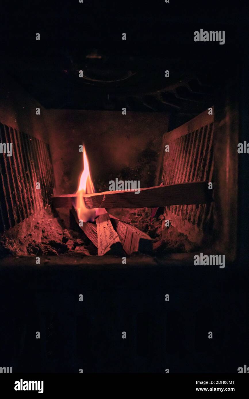 a fire starting inside a very old stove Stock Photo - Alamy