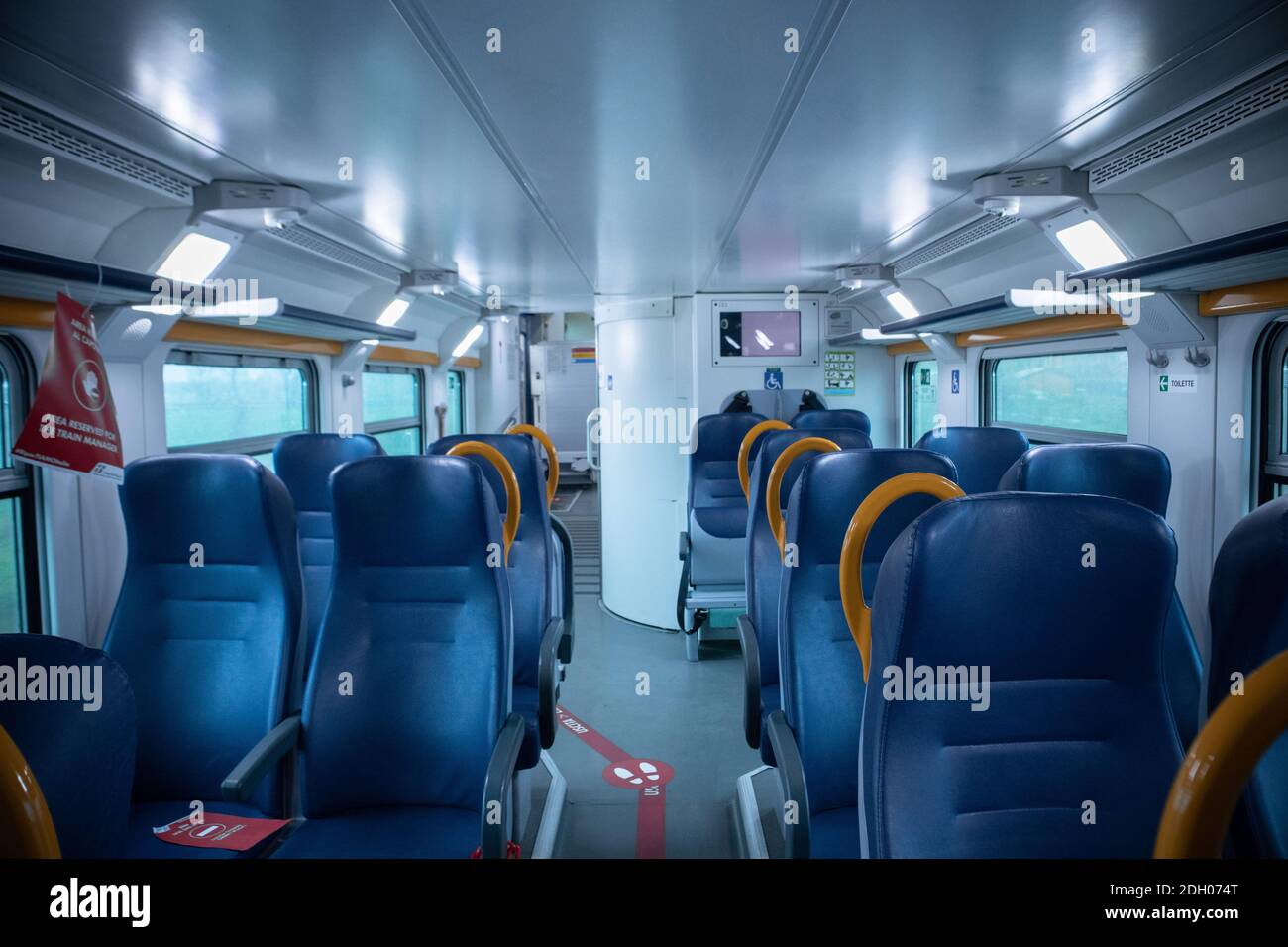 an empty coach with blue seats Stock Photo - Alamy