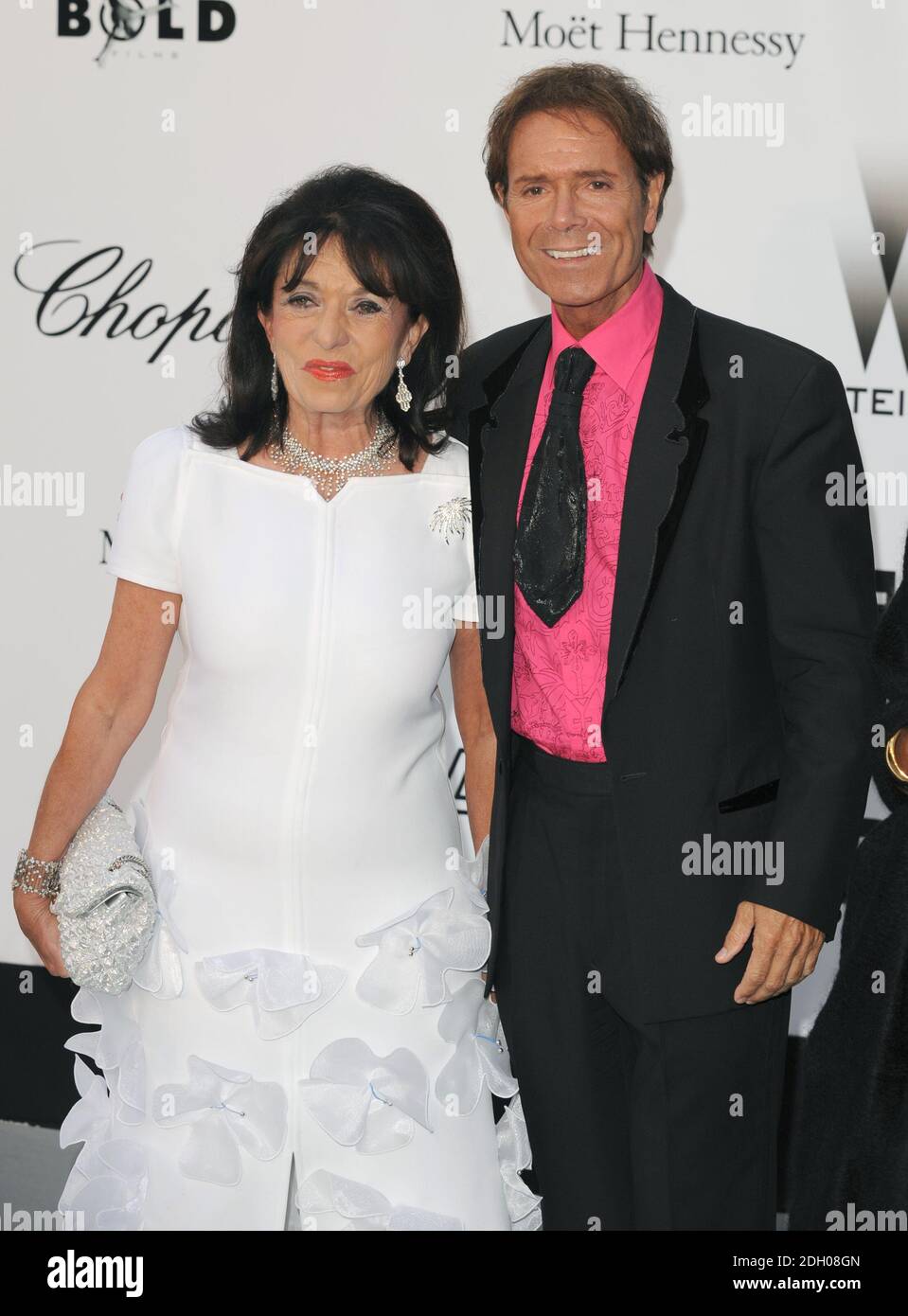 Cliff Richard and companion arriving for the amfAR Gala Dinner and ...