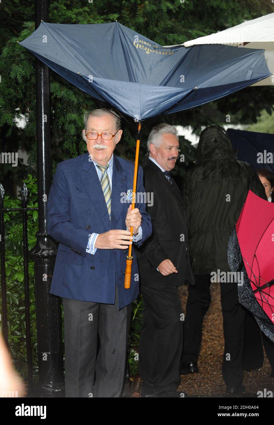 Alan Whicker arrives at Sir David Frost's Summer Garden Party, in ...