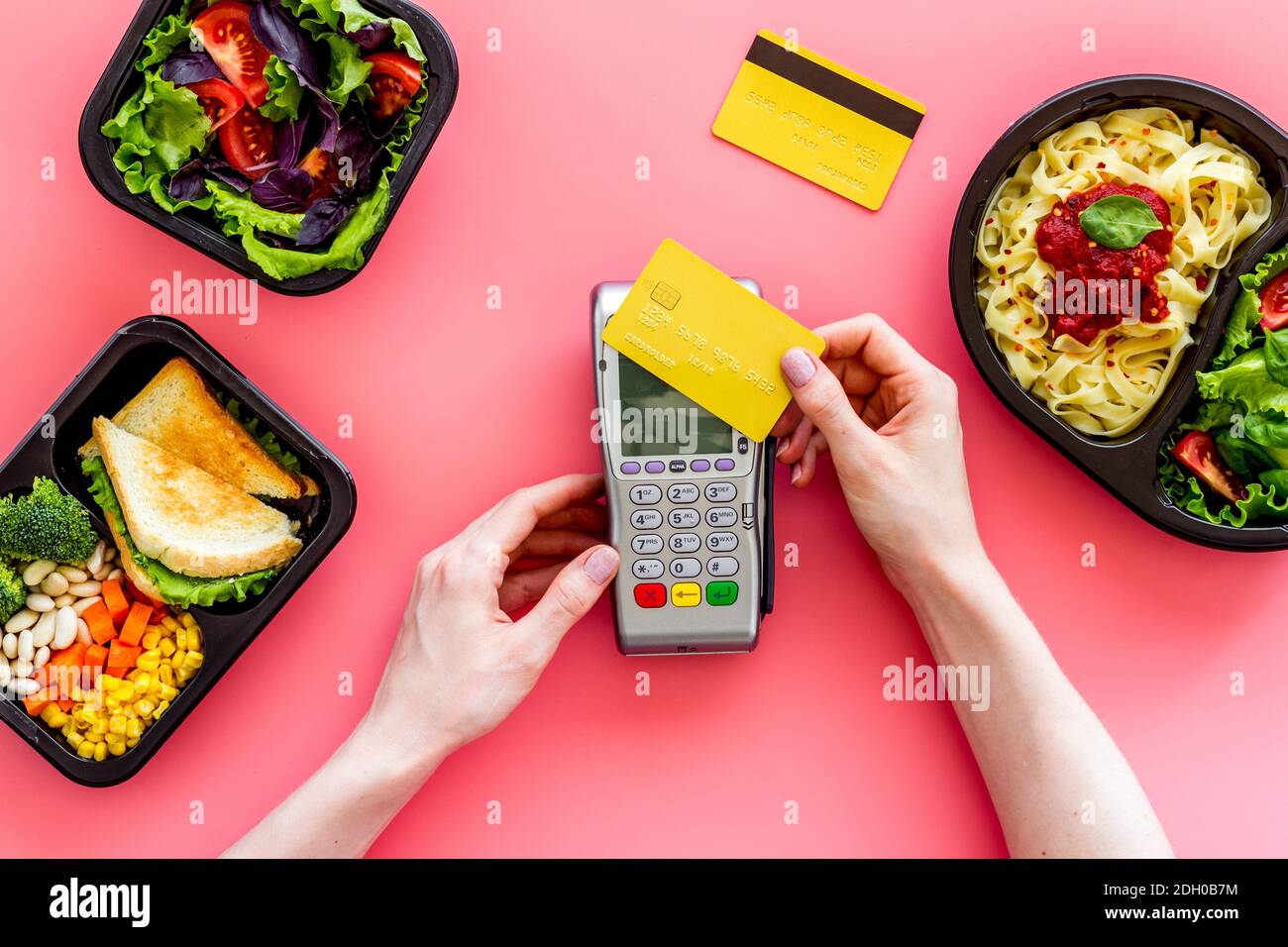 Hands with credit card and payment terminal. Restaurant food delivery ...