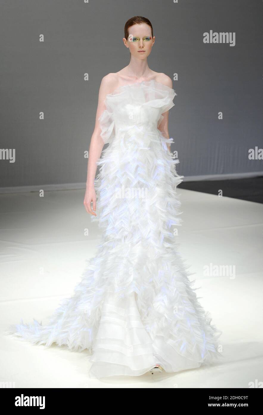 A model wears a creation by Ashley Isham, during London Fashion Week at ...