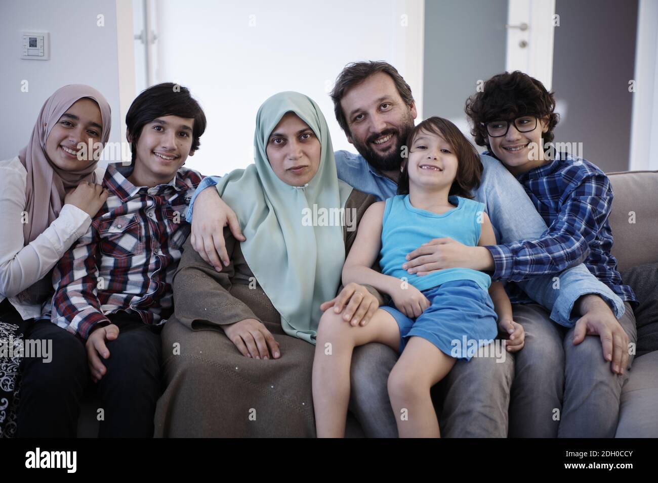 Muslim family portrait at home Stock Photo - Alamy