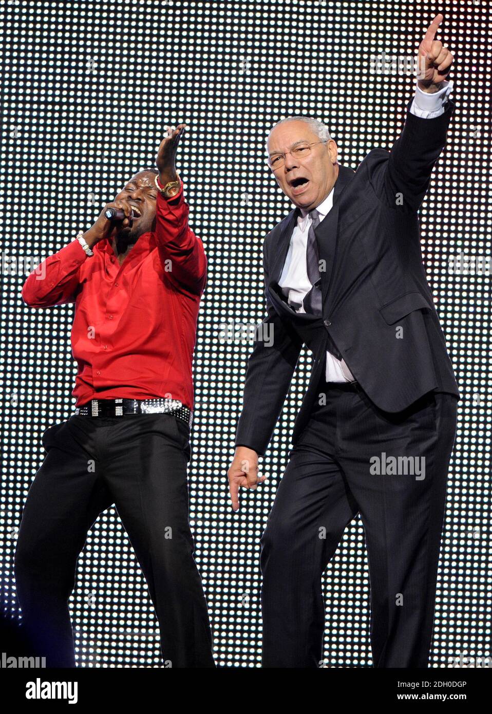 Colin Powell dances on stage with Olu Maintain at the Africa Rising ...