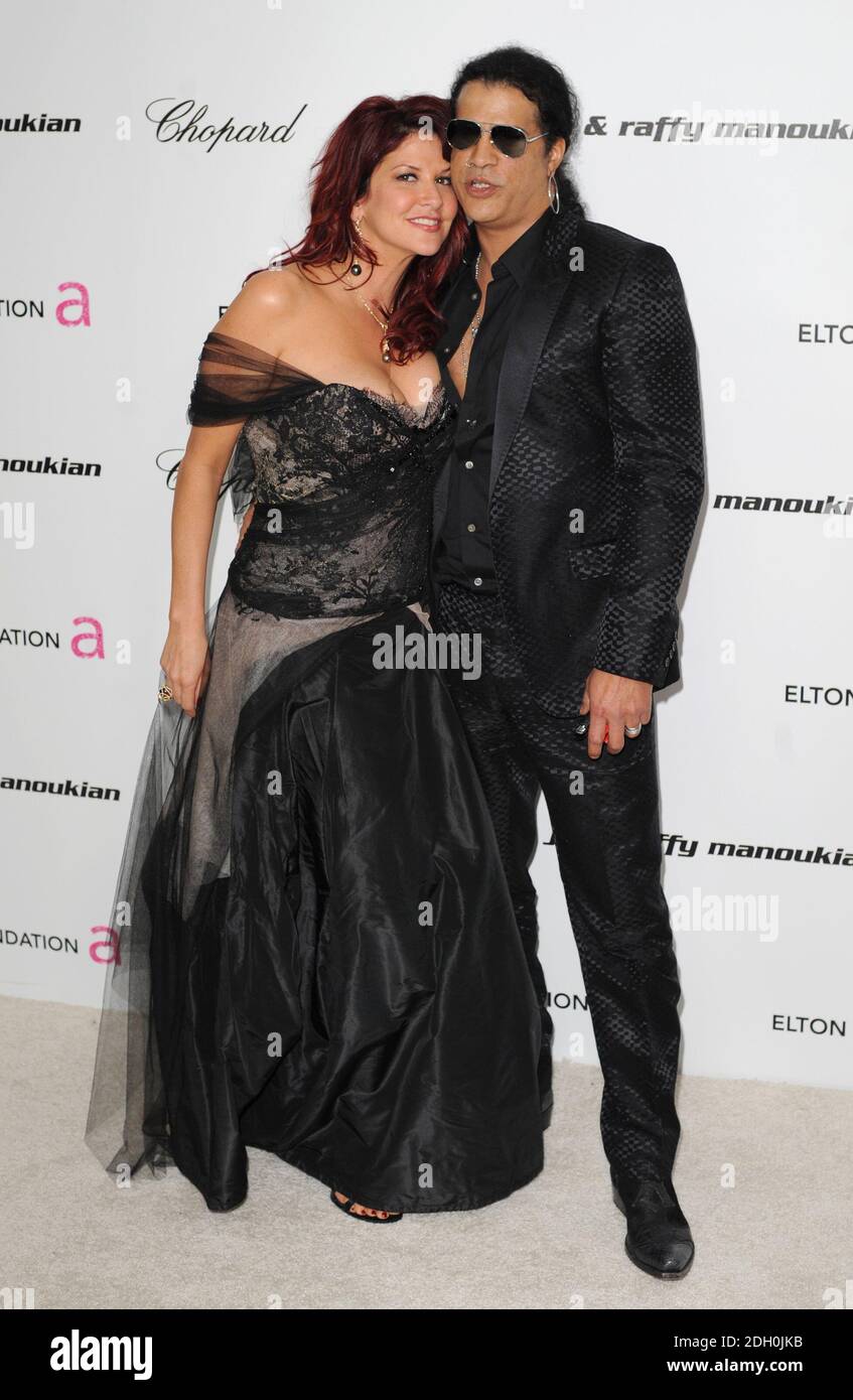 Slash and his wife Perla Hudson arriving at the 17th Annual Elton John ...