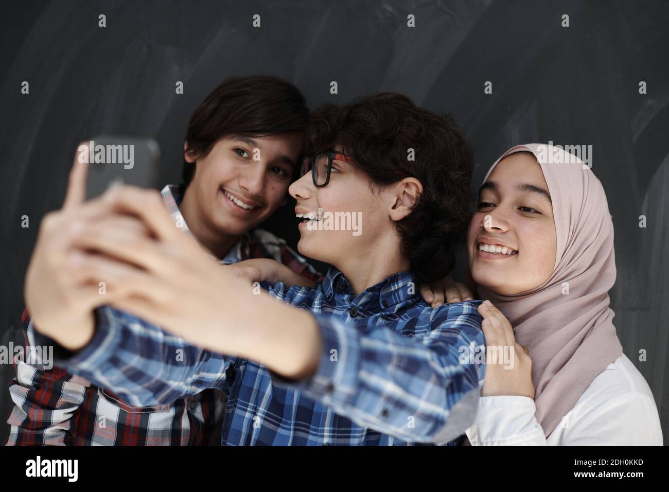 Middle east boy mobile phone hi-res stock photography and images - Alamy