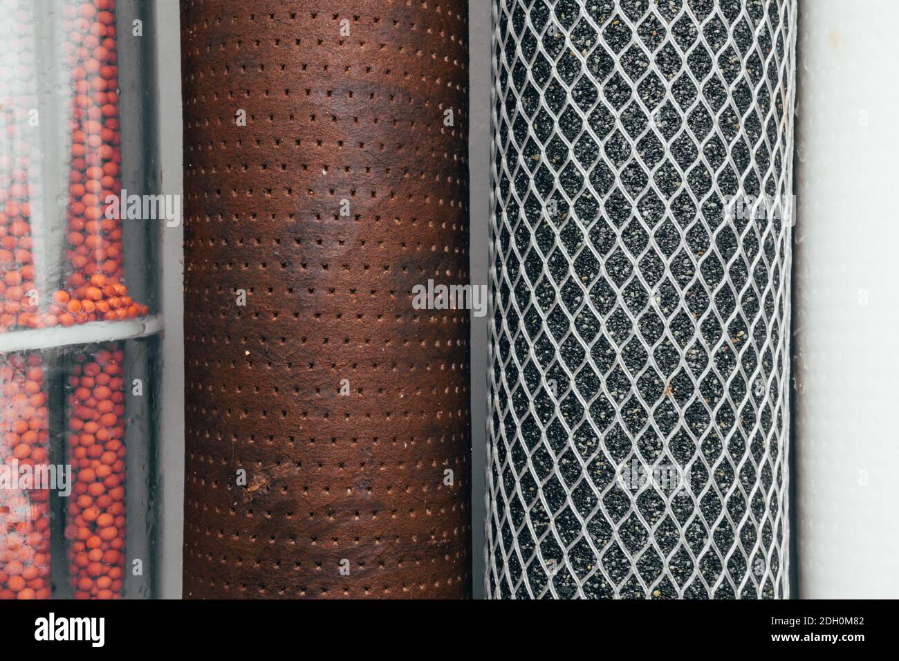 Water filter cartridges new and used with rusty brown coloring, glass ...