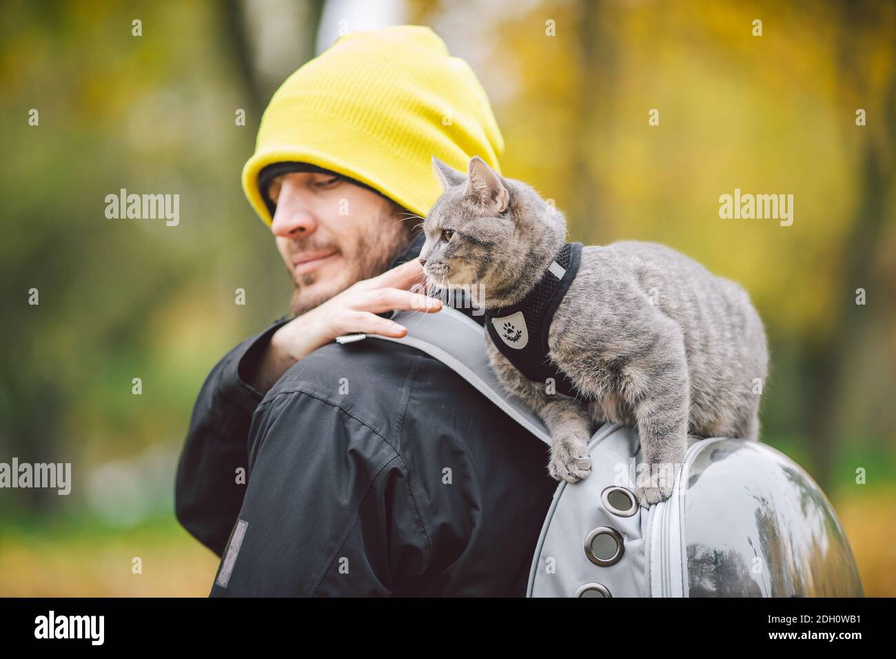 Street walk autumn,adult Caucasian man wearing dark jacket bright ...