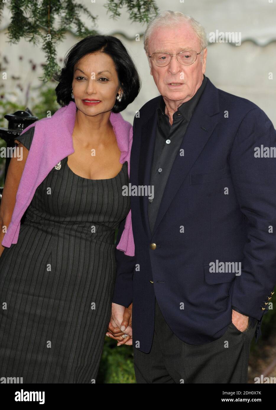 Michael Caine (L) and his wife Shakira Caine arriving at the Sir David ...
