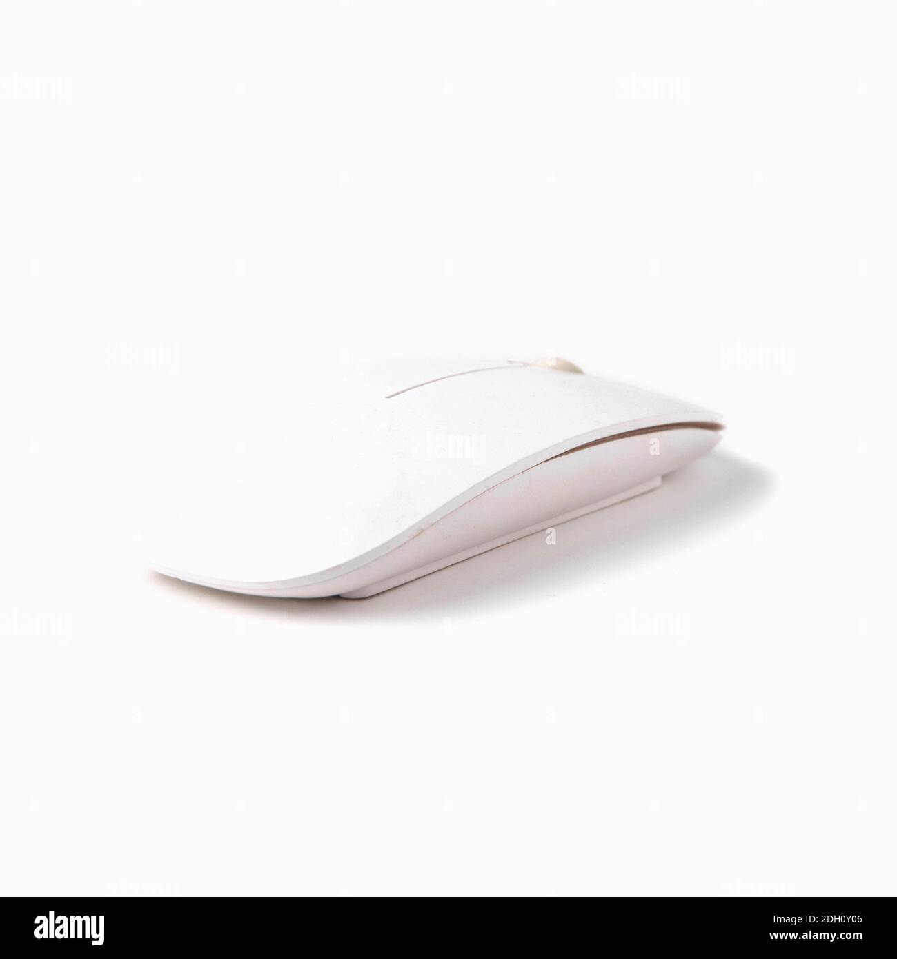 White wireless computer mouse. Isolated on a white background. Side ...