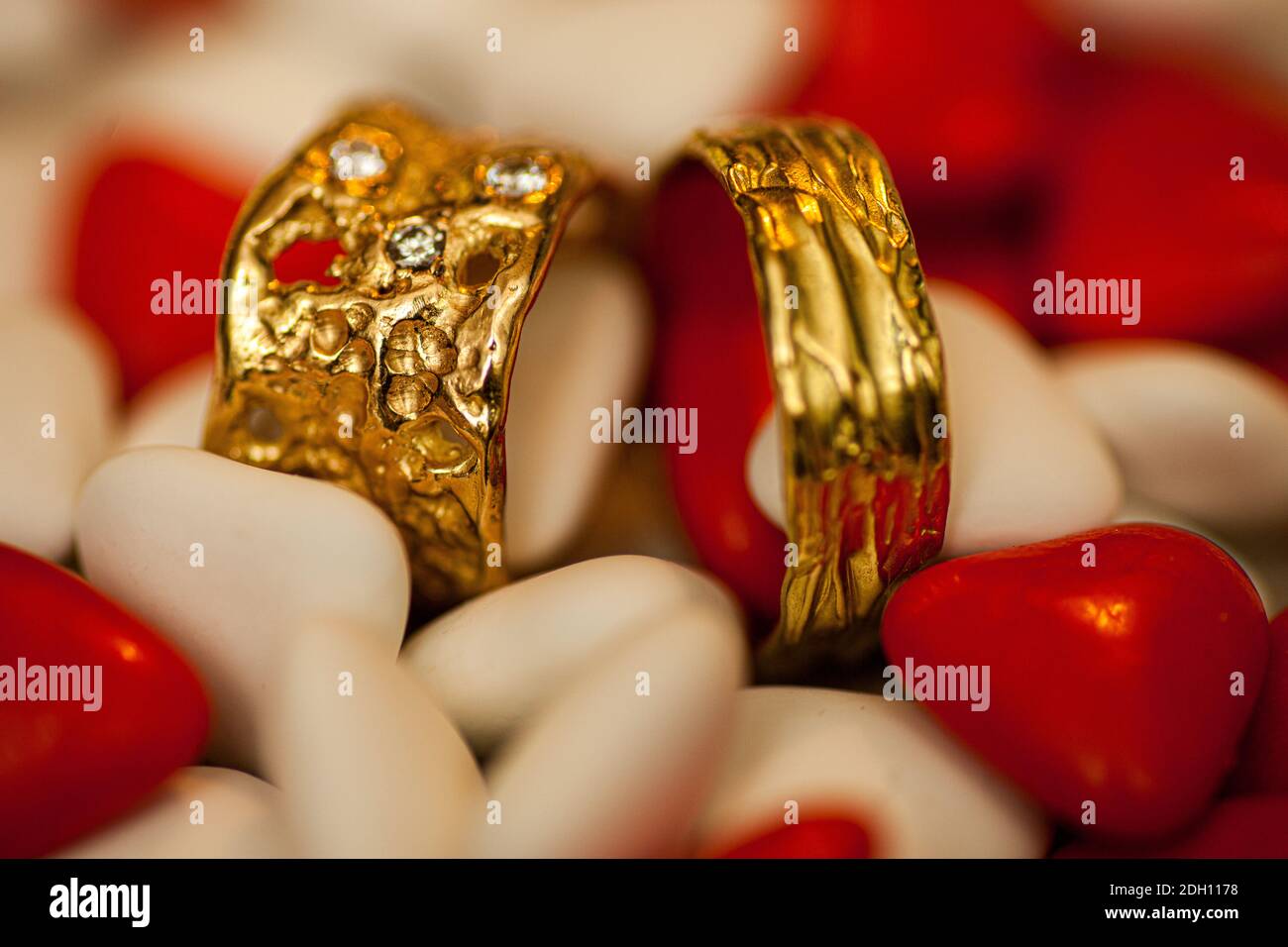 Wedding rings on a candy background Stock Photo - Alamy