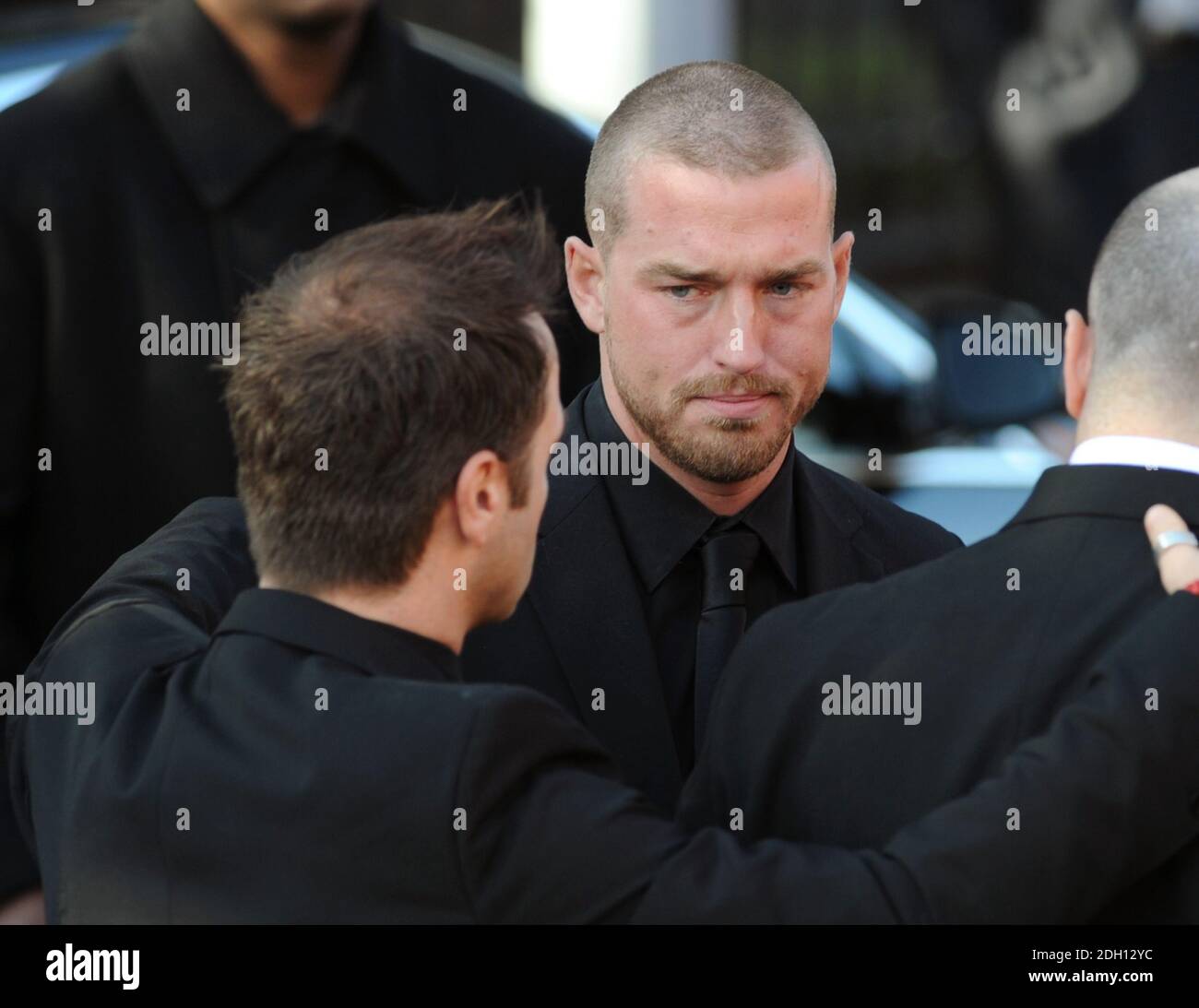 Stephen Gately's partner Andrew Cowles, with Mikey Graham at the ...
