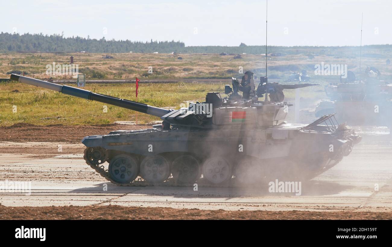 A Belarusian tank rushes past the stands with spectators during the ...