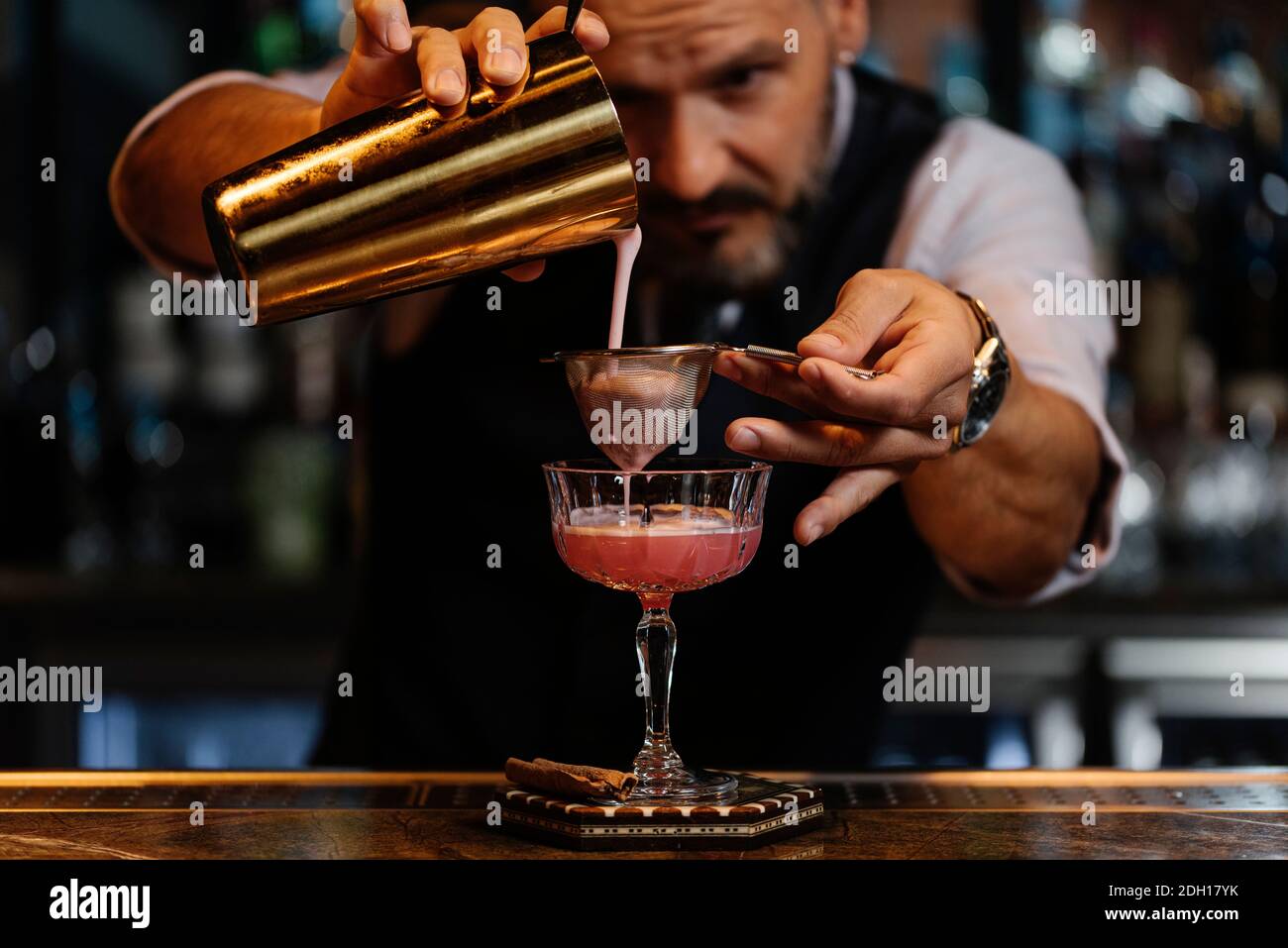 Stock photo of a barman doing some cocktails at nightclub Stock Photo ...