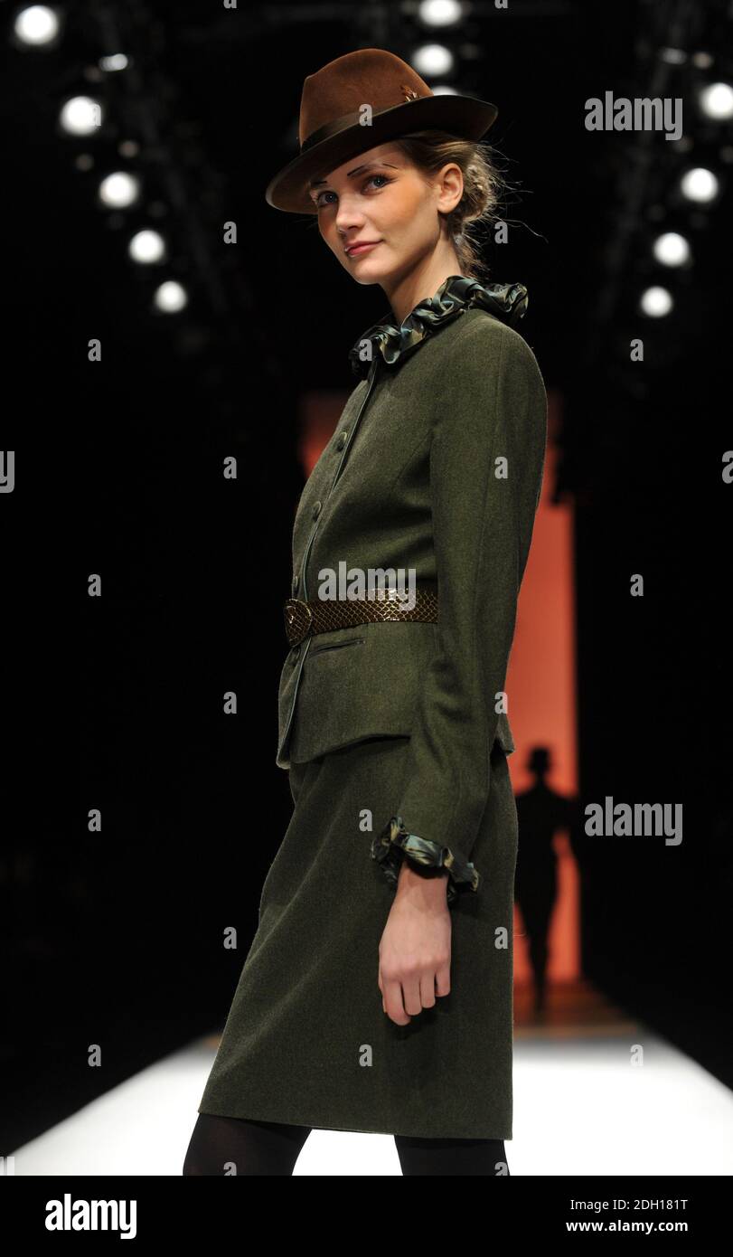A model on the catwalk during the show by Caroline Charles as part of ...