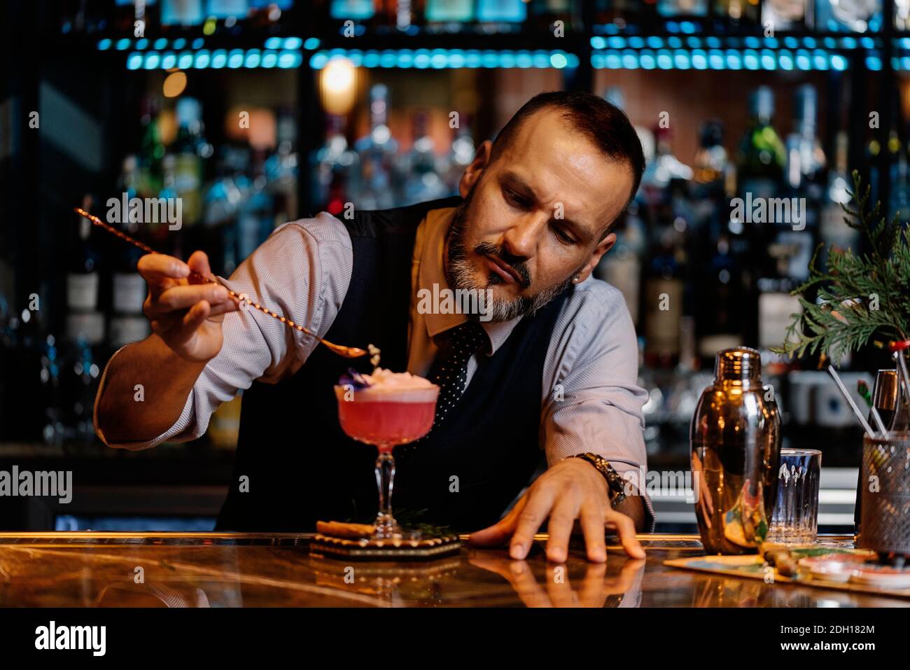 Stock photo of a barman doing some cocktails at nightclub Stock Photo ...
