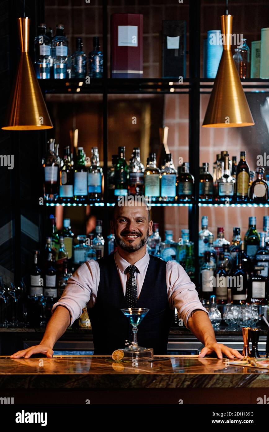 Stock photo of a barman doing some cocktails at nightclub Stock Photo ...