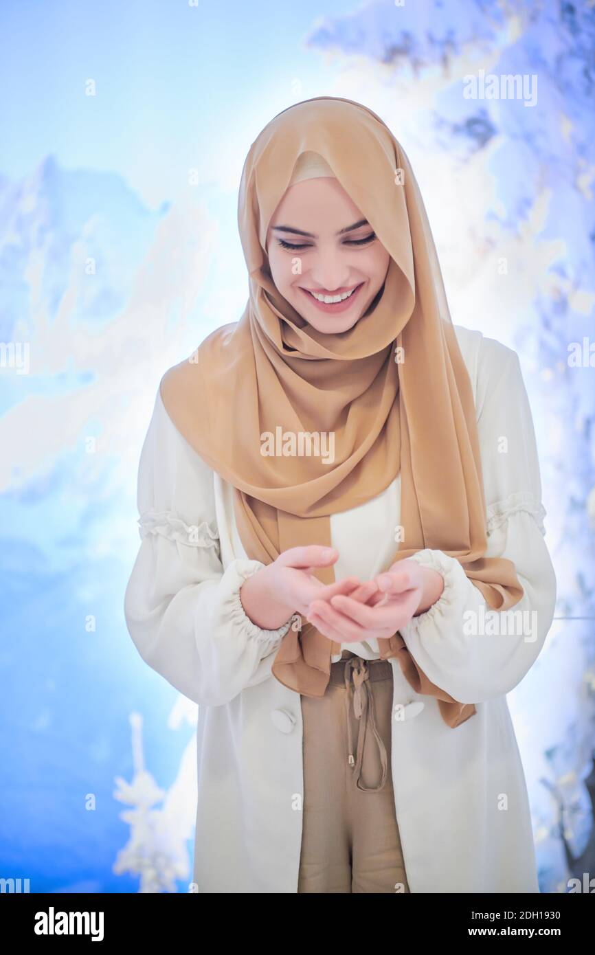 Muslim woman making traditional prayer hi-res stock photography and ...