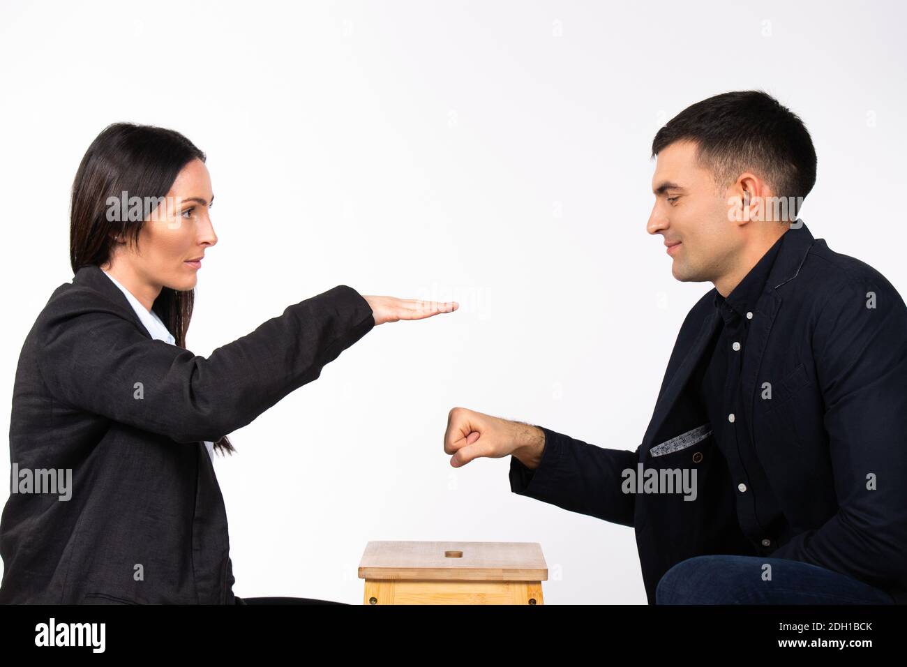 A strong woman wins a battle with a man. Business partners and business ...