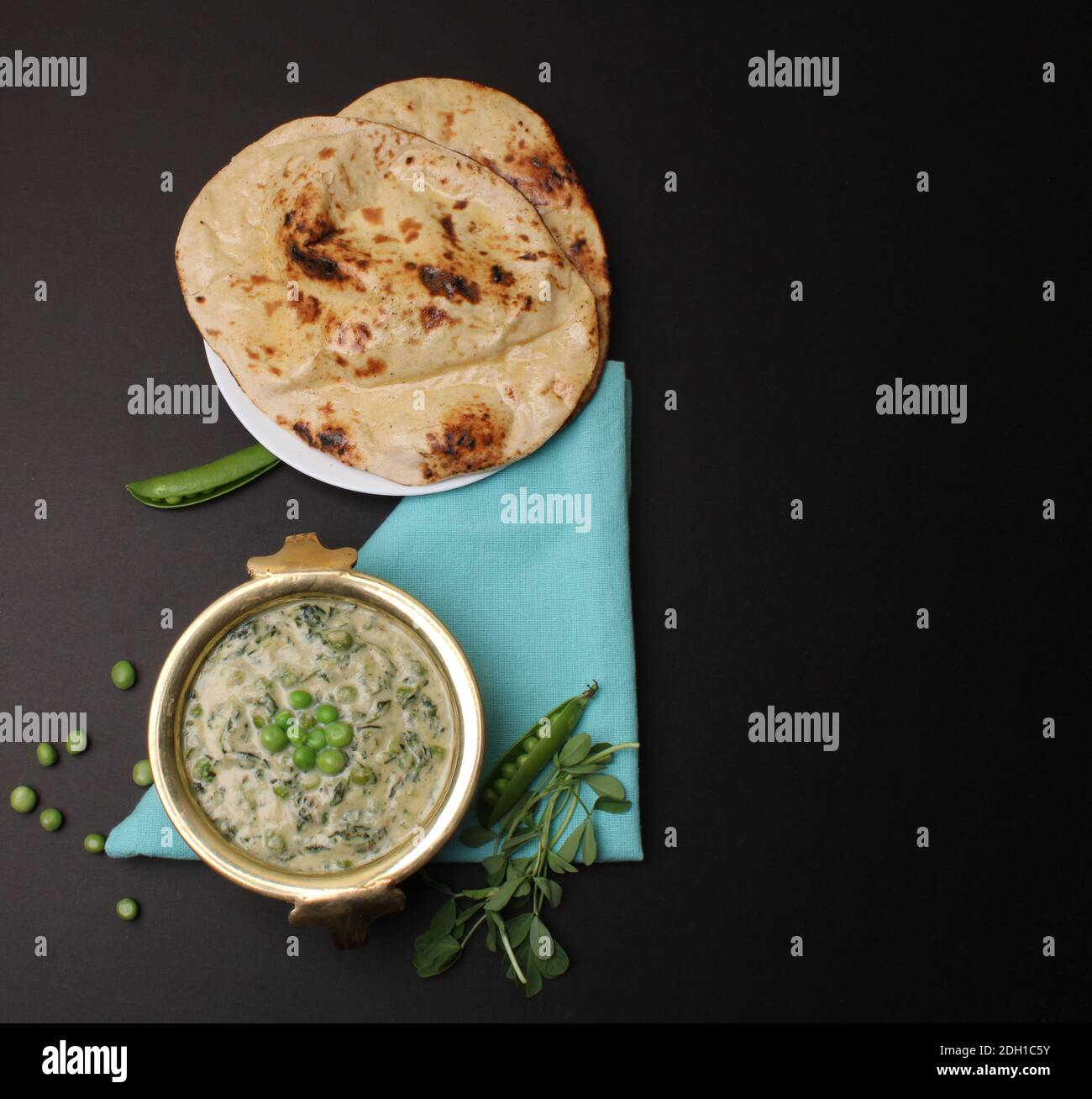 Methi Mutter Malai, Indian food server with naan or tandoori roti Stock ...