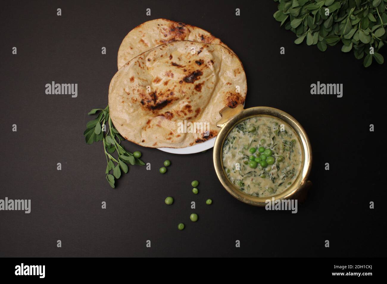 Methi Mutter Malai, Indian food server with naan or tandoori roti Stock ...
