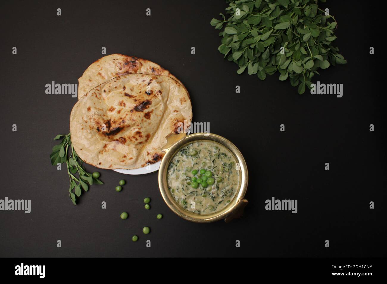 Methi Mutter Malai, Indian food server with naan or tandoori roti Stock ...