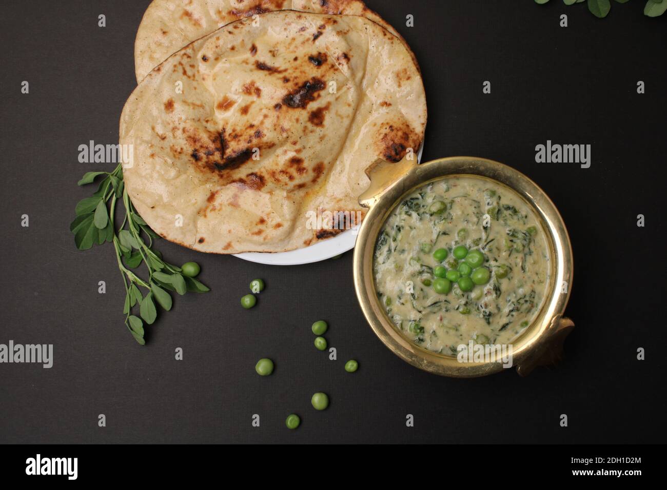Methi Mutter Malai, Indian food server with naan or tandoori roti Stock ...
