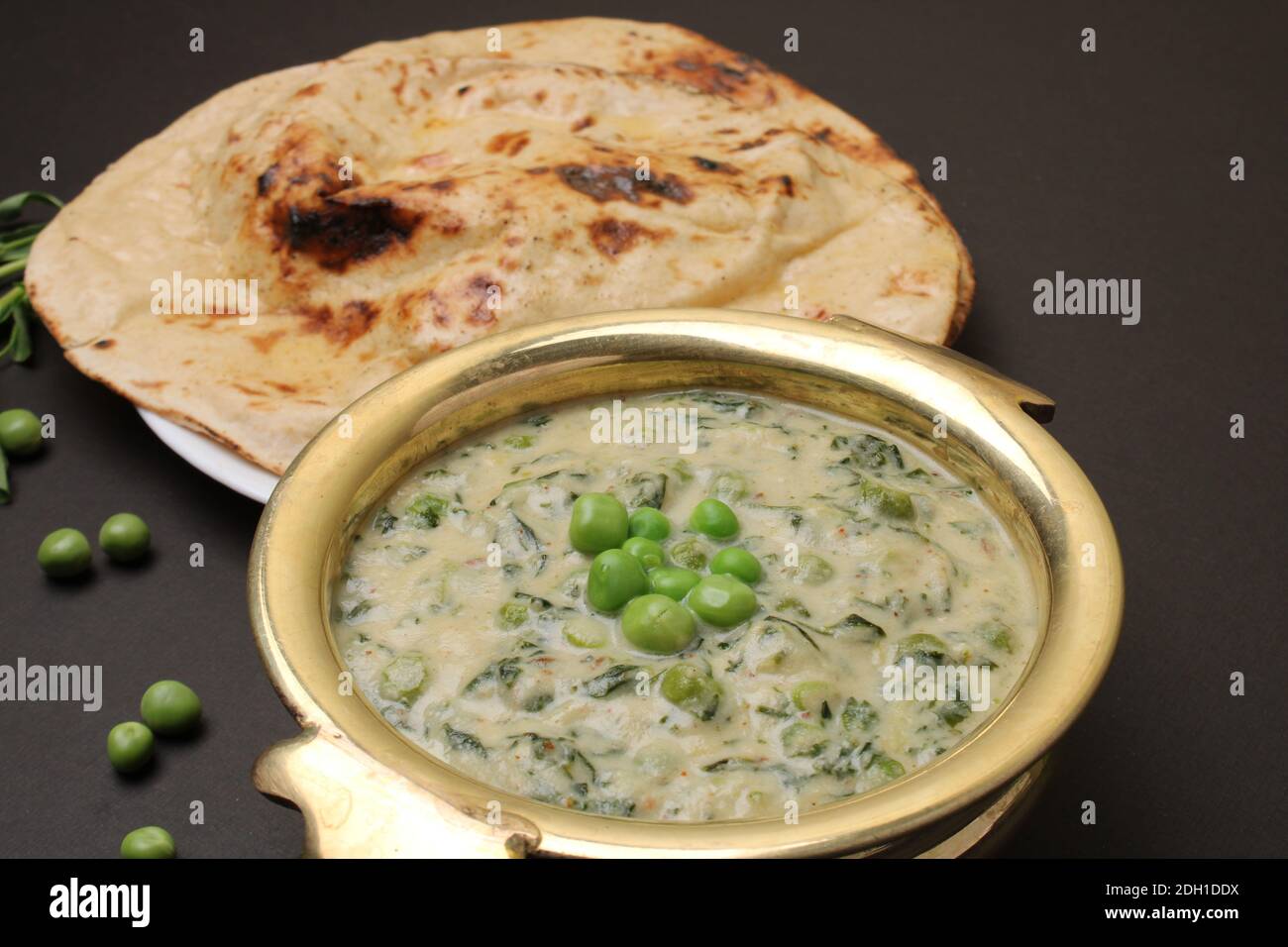 Methi Mutter Malai, Indian food server with naan or tandoori roti Stock ...