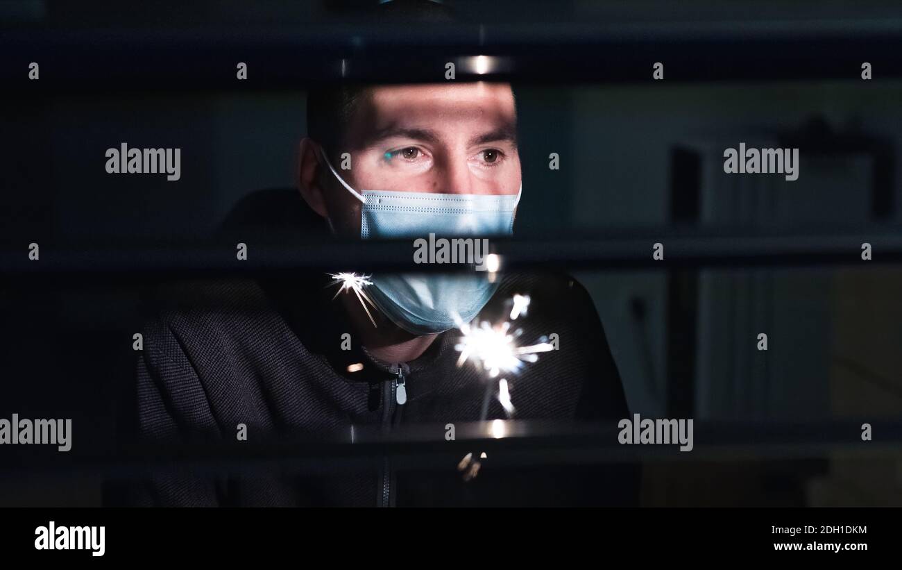 Man in Quarantine for new year Looking out the Window. Staying Home at ...