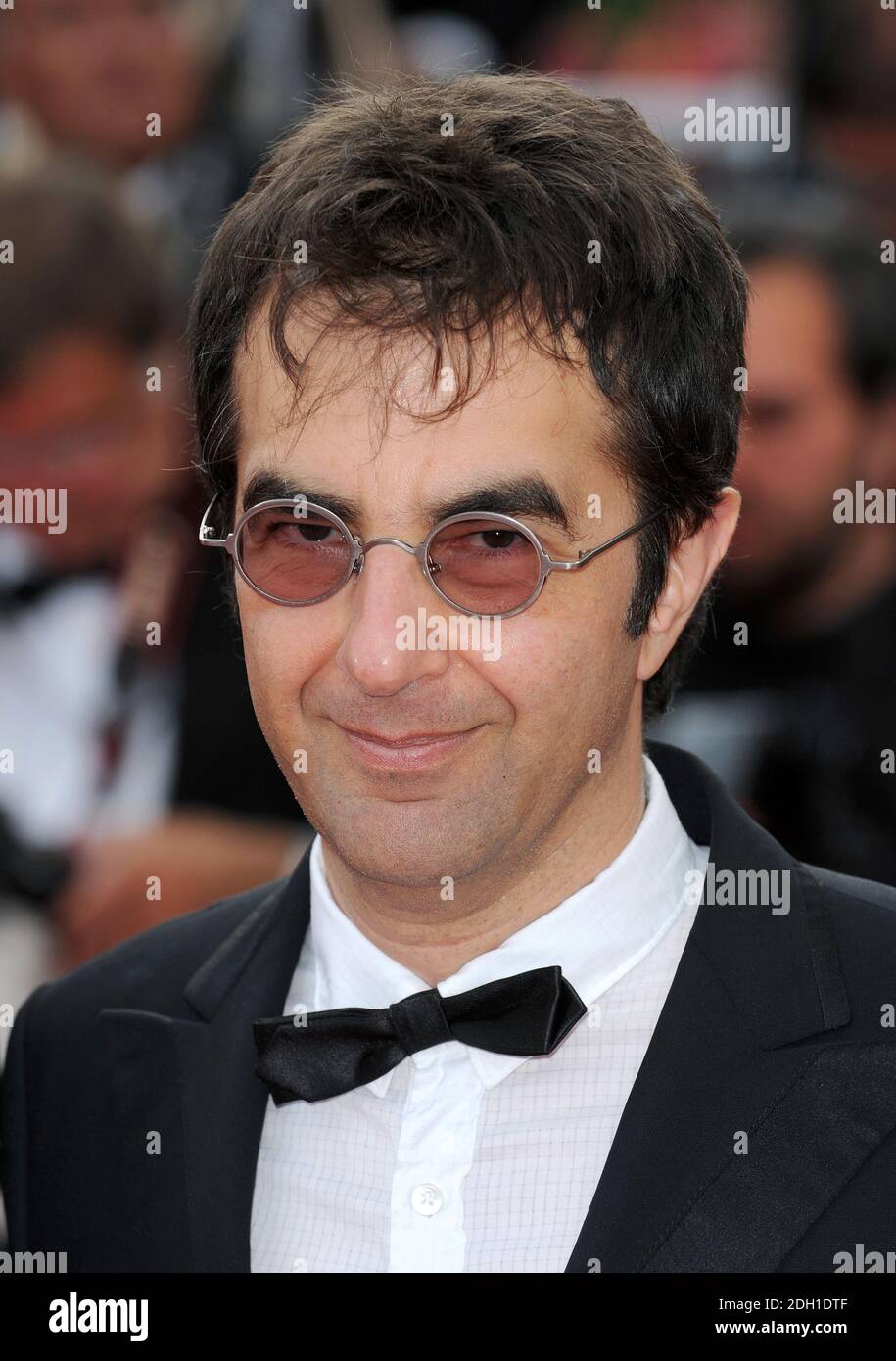 Atom Egoyan arrives for the premiere of Poetry at the Grand Auditorium ...