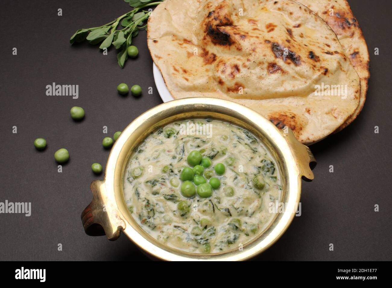 Methi Mutter Malai, Indian food server with naan or tandoori roti Stock ...