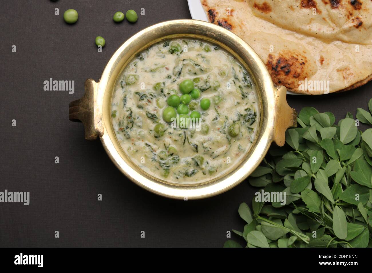 Methi Mutter Malai, Indian food server with naan or tandoori roti Stock ...