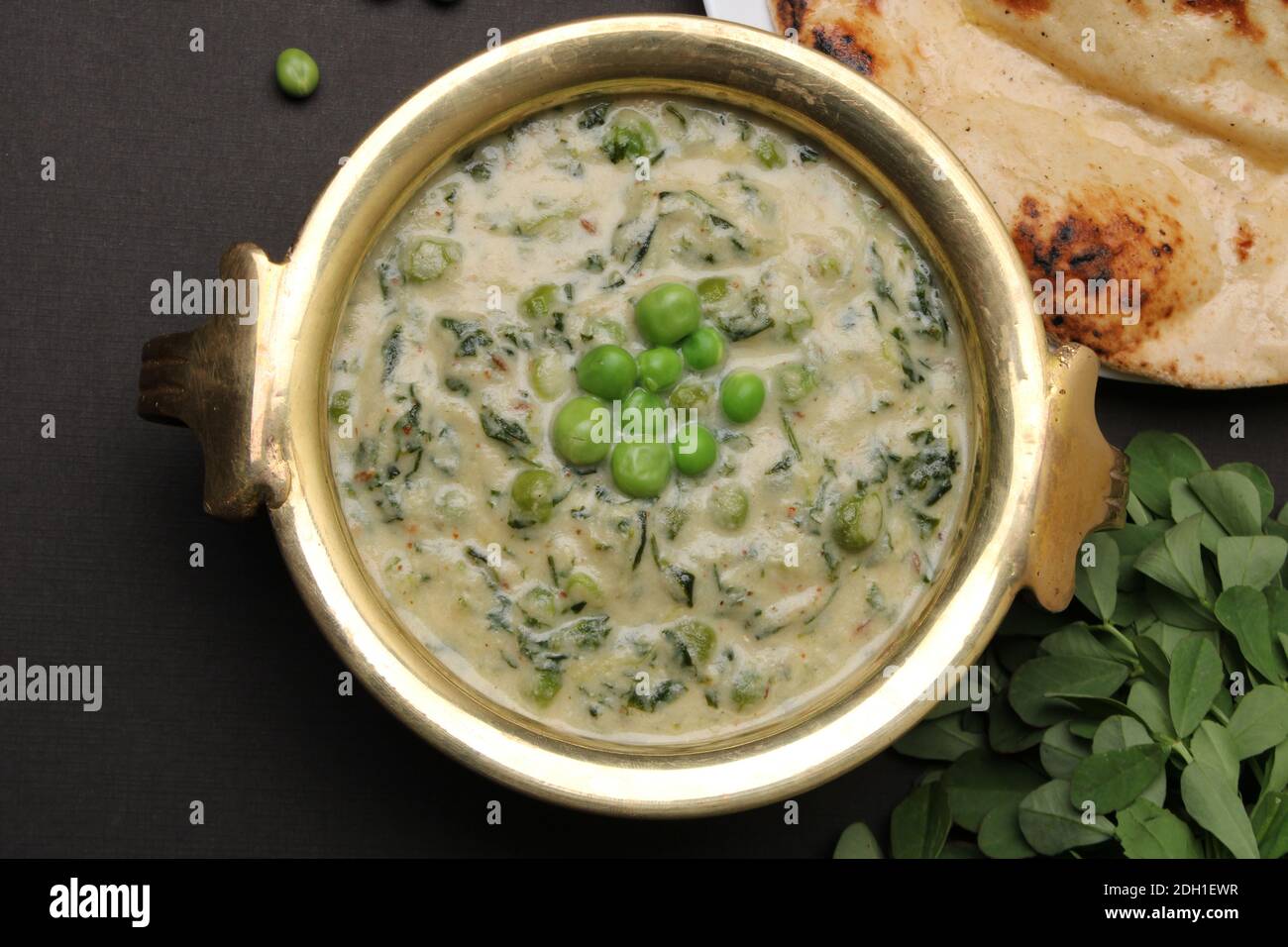 Methi Mutter Malai, Indian food server with naan or tandoori roti Stock ...