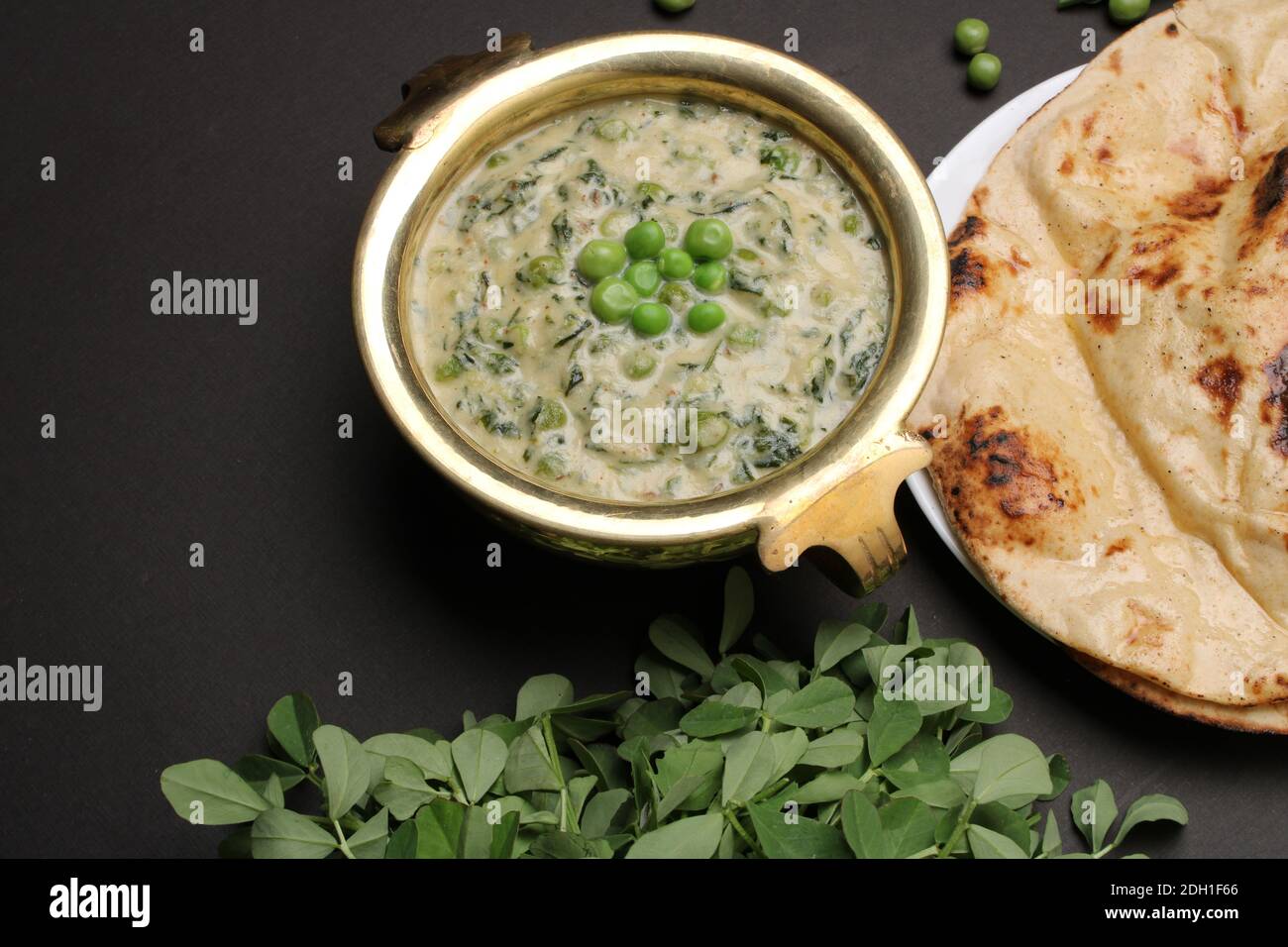 Methi Mutter Malai, Indian food server with naan or tandoori roti Stock ...