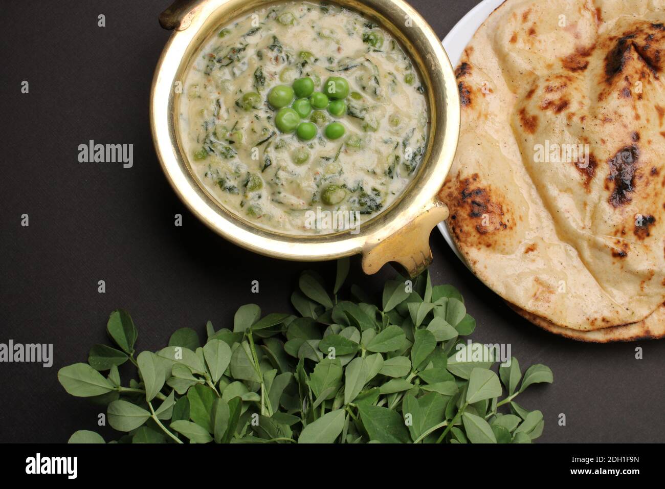 Methi Mutter Malai, Indian food server with naan or tandoori roti Stock ...