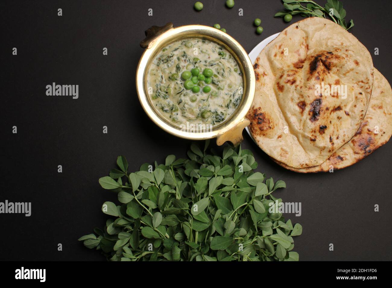 Methi Mutter Malai, Indian food server with naan or tandoori roti Stock ...