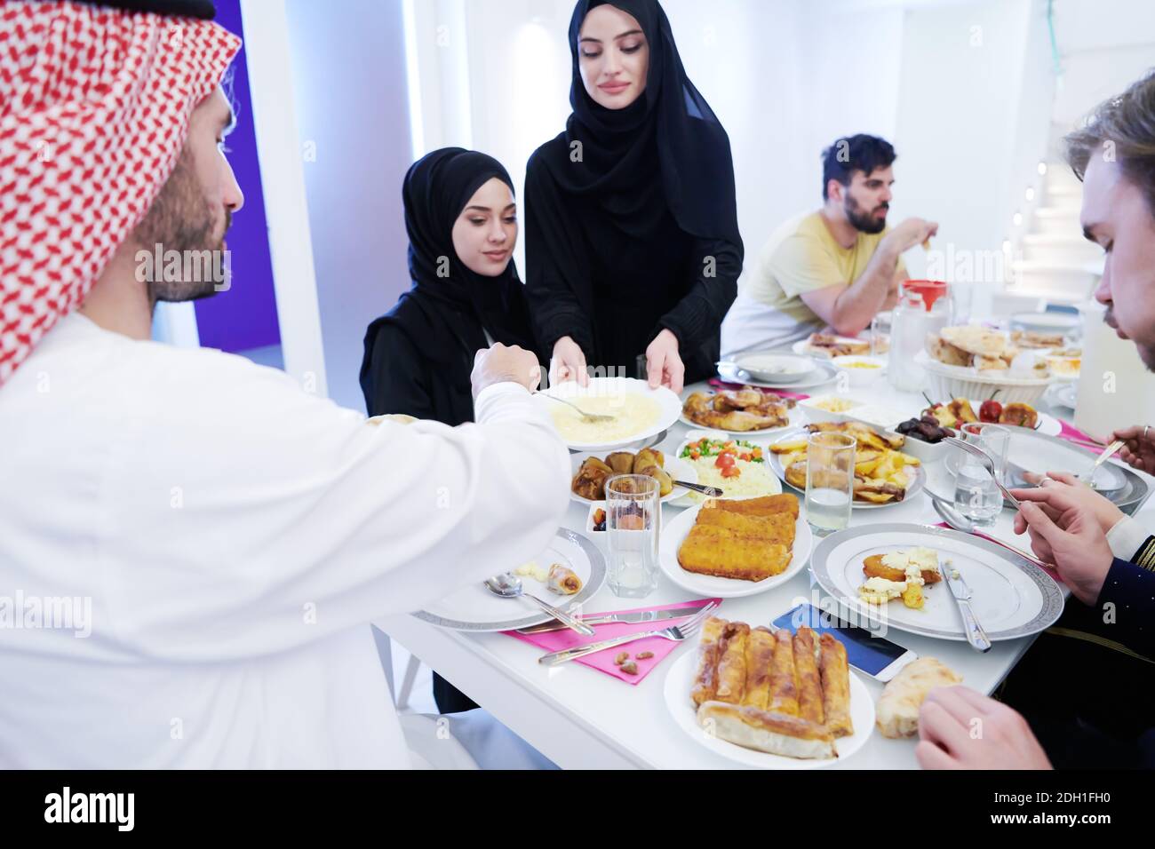 Muslim family having a Ramadan feast Stock Photo - Alamy