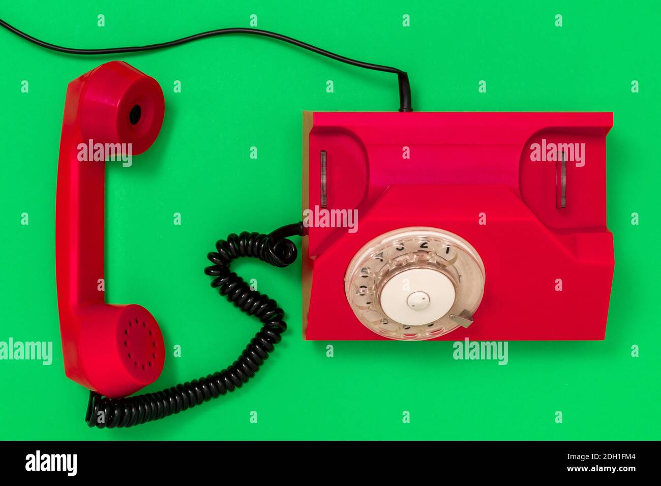Old red telephone rings with handset off. Rotary antique telephone ...