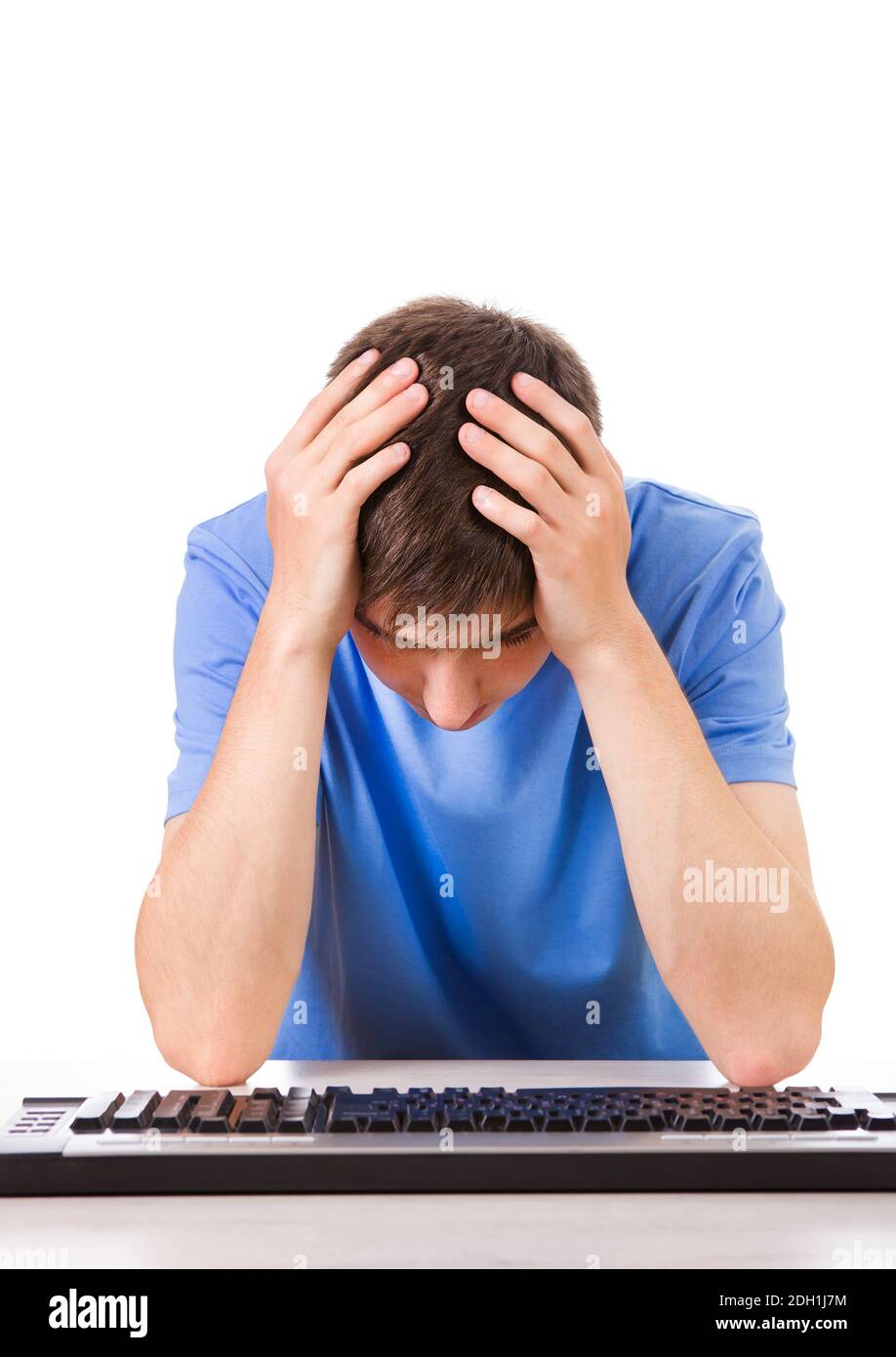 Sad Man with a Computer Keyboard on the White Background Stock Photo ...