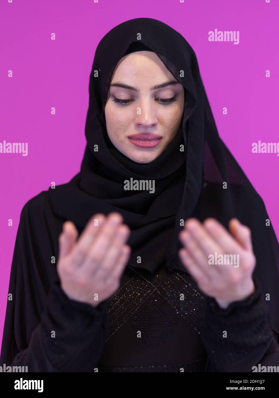 Muslim woman making traditional prayer hi-res stock photography and ...