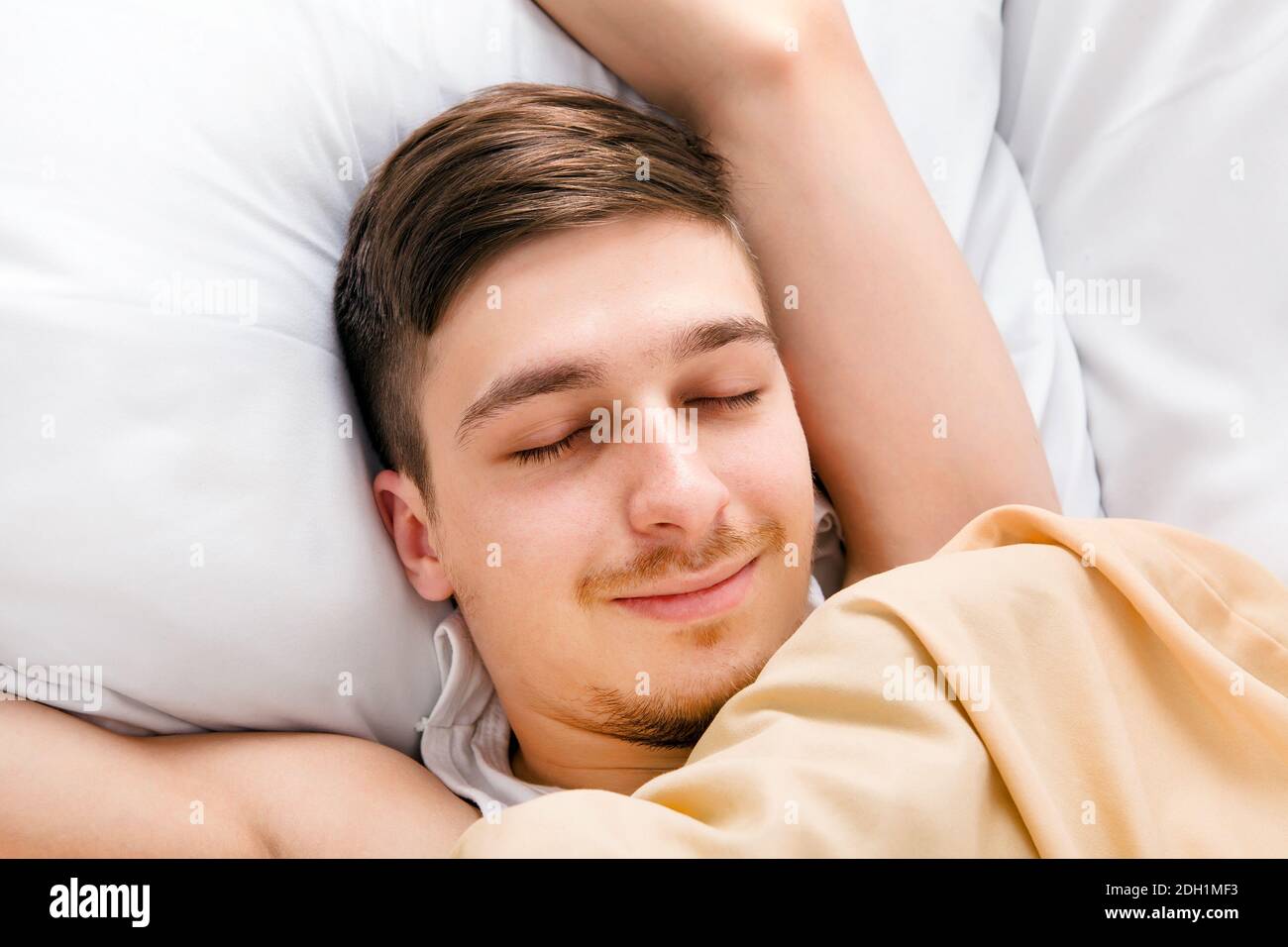 Young Man sleep in the Bed at the Home Stock Photo - Alamy