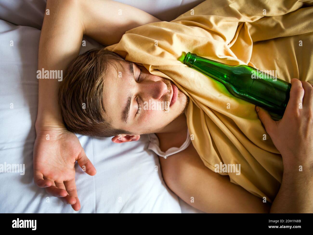 Man sleeping beer bottle hi-res stock photography and images - Alamy