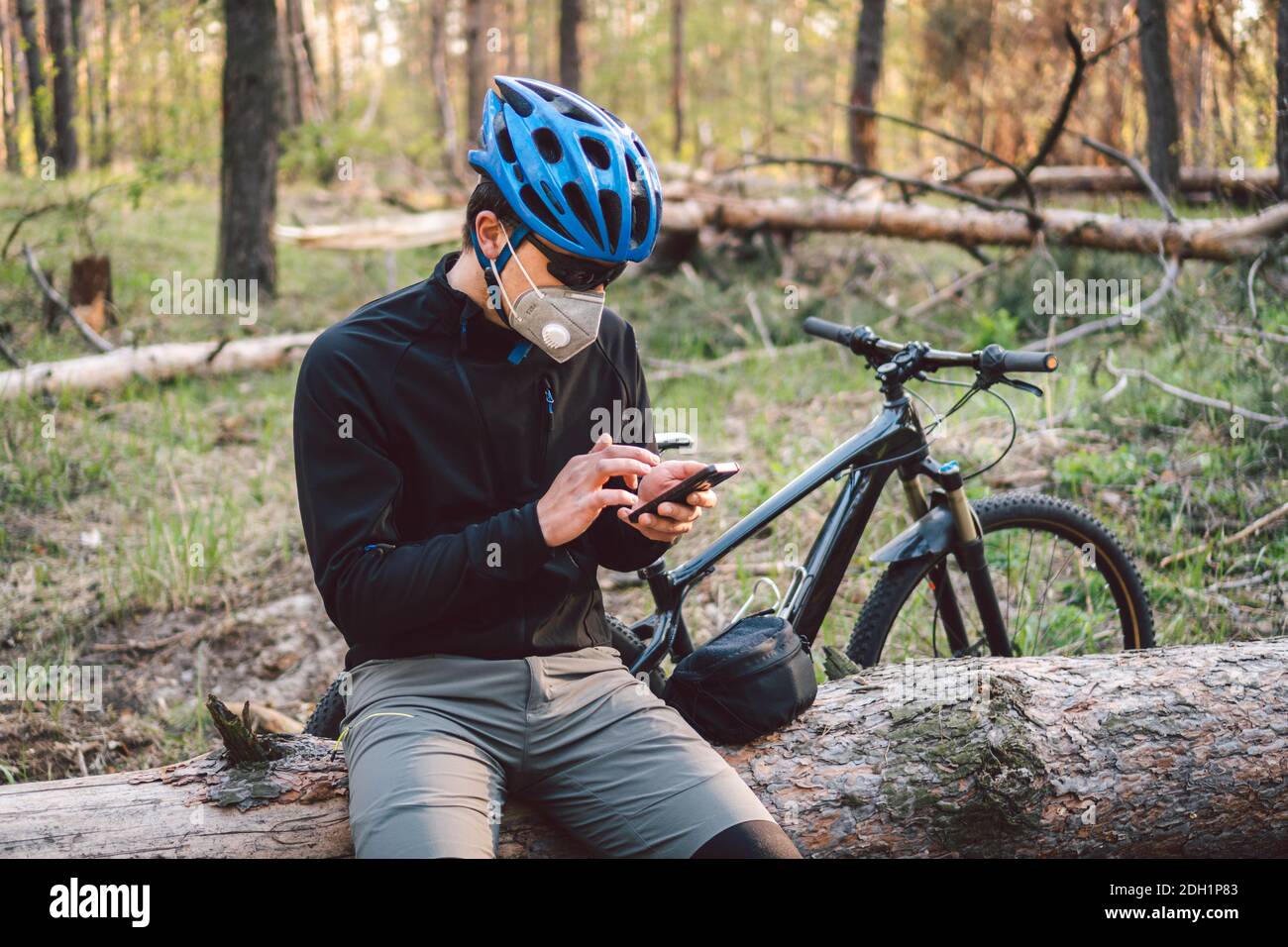 Male cyclist wearing respirator face mask with heavy duty protective ...