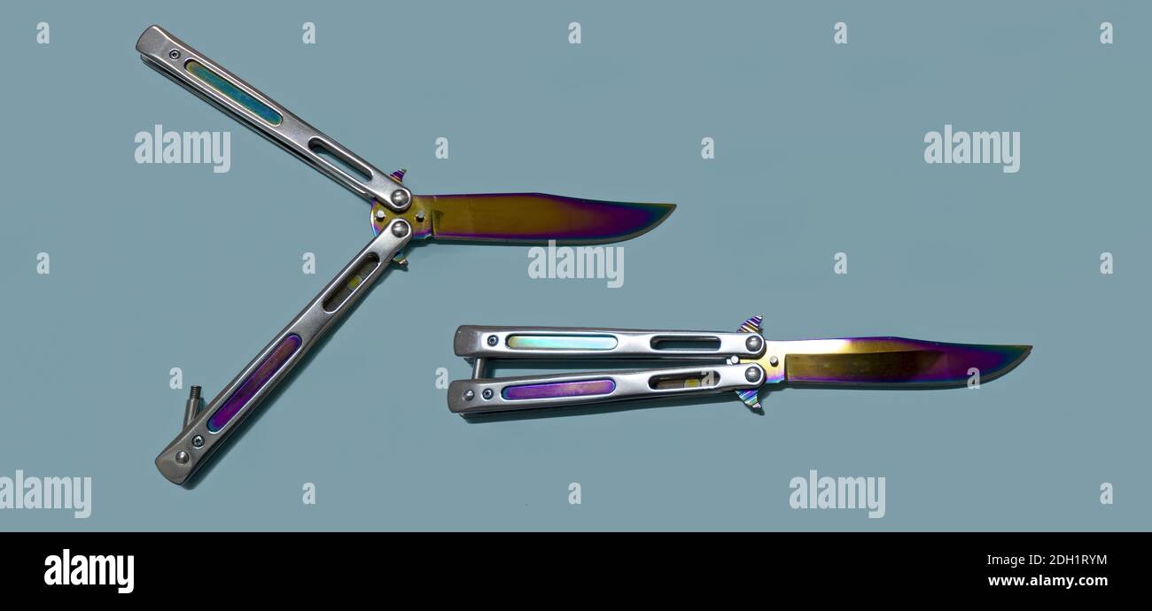 Knife type balisong or butterfly or fan on blue background, prohibited ...