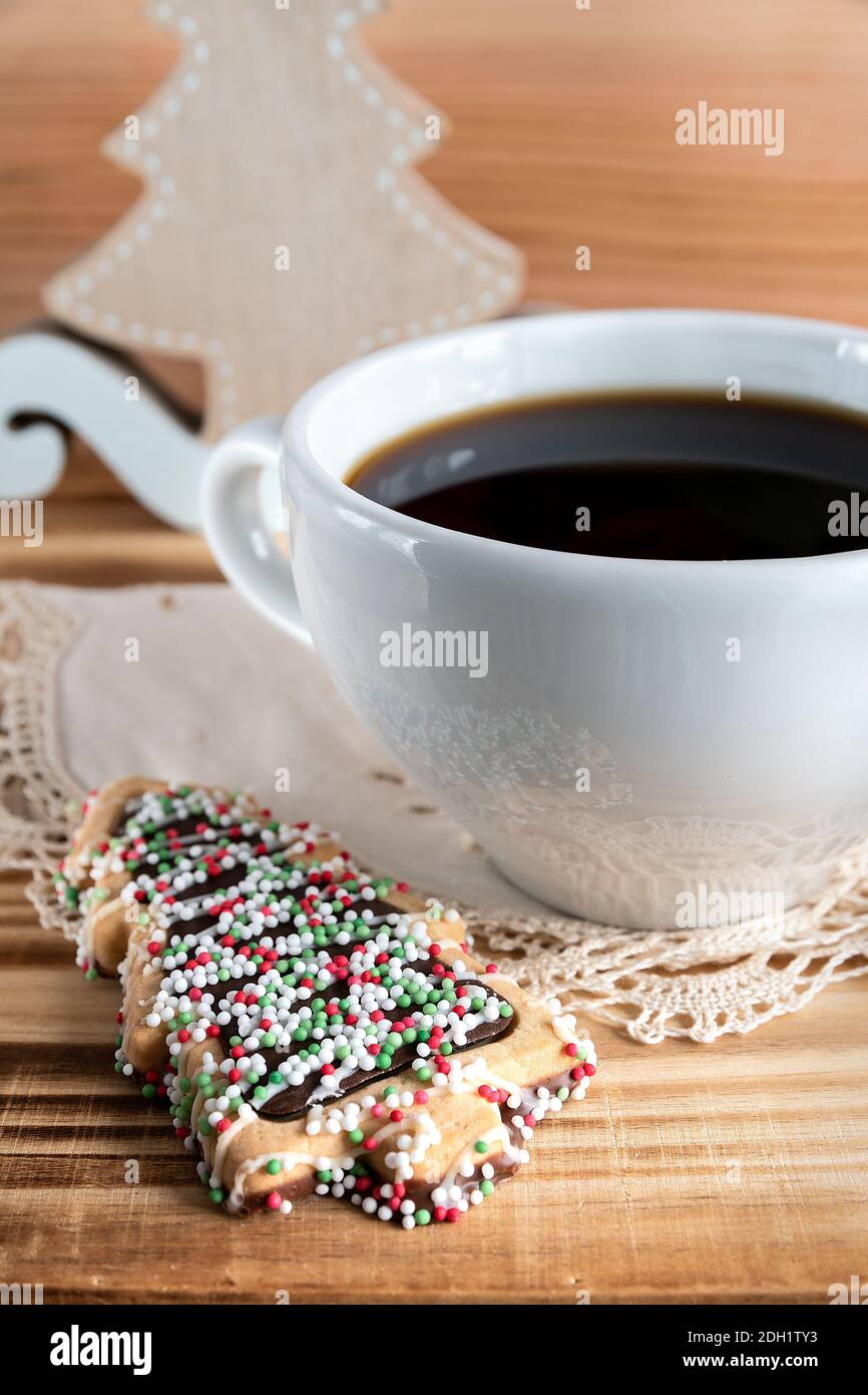 Cup of coffee with christmas tree cookies Stock Photo - Alamy