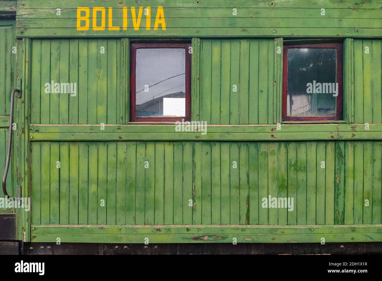 Green wooden train car with the word Bolivia written in yellow letters ...