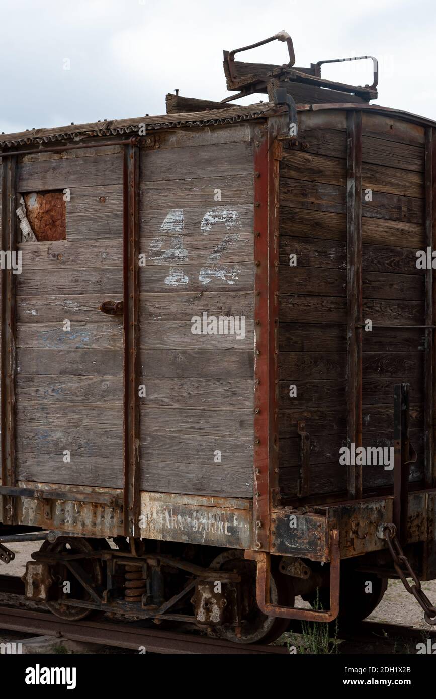 Old and rusty wooden train car abandoned on a railway track. Bolivia ...