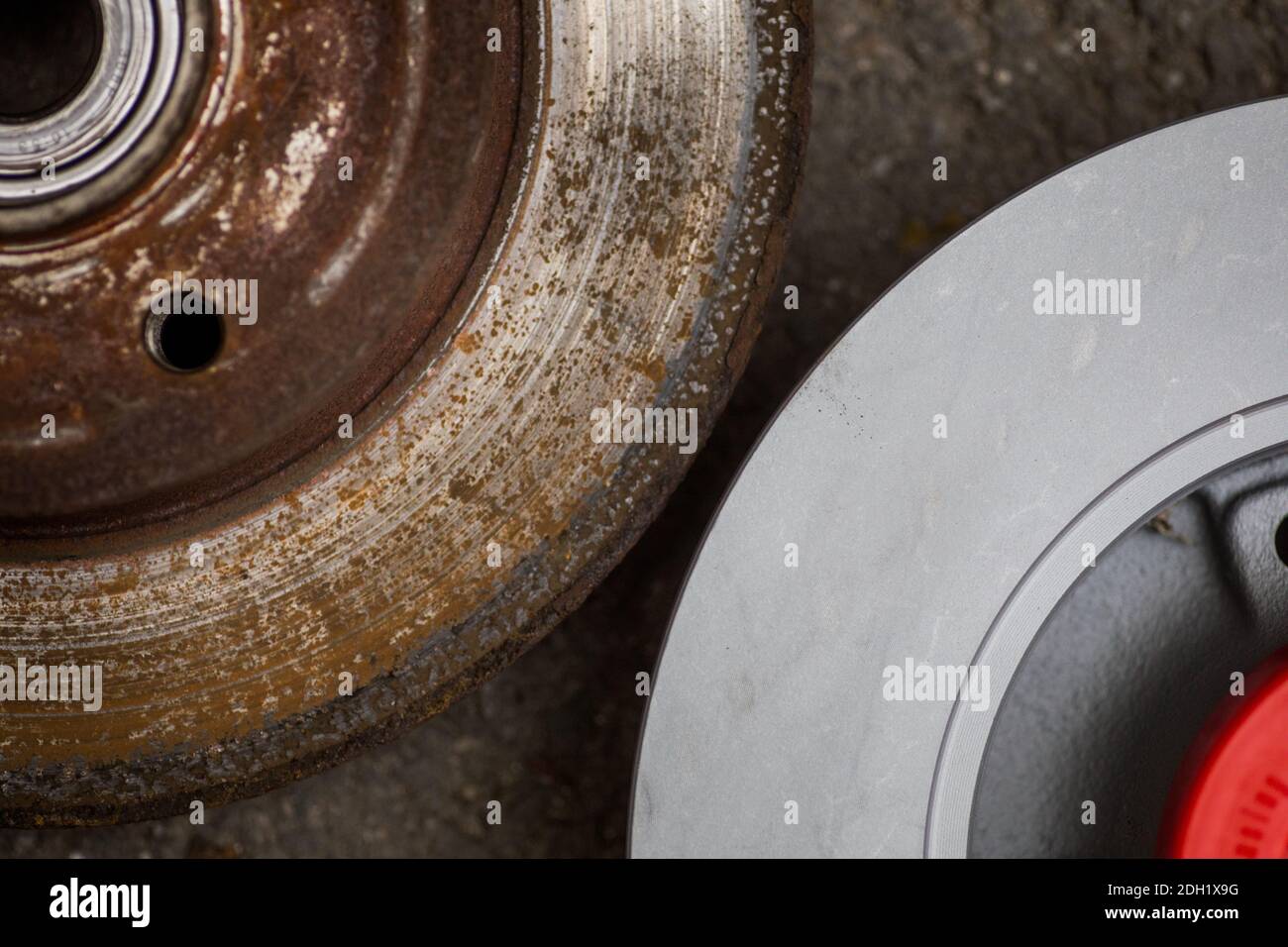 Close up shot of a car worn and rusty brake disk and a new one Stock ...