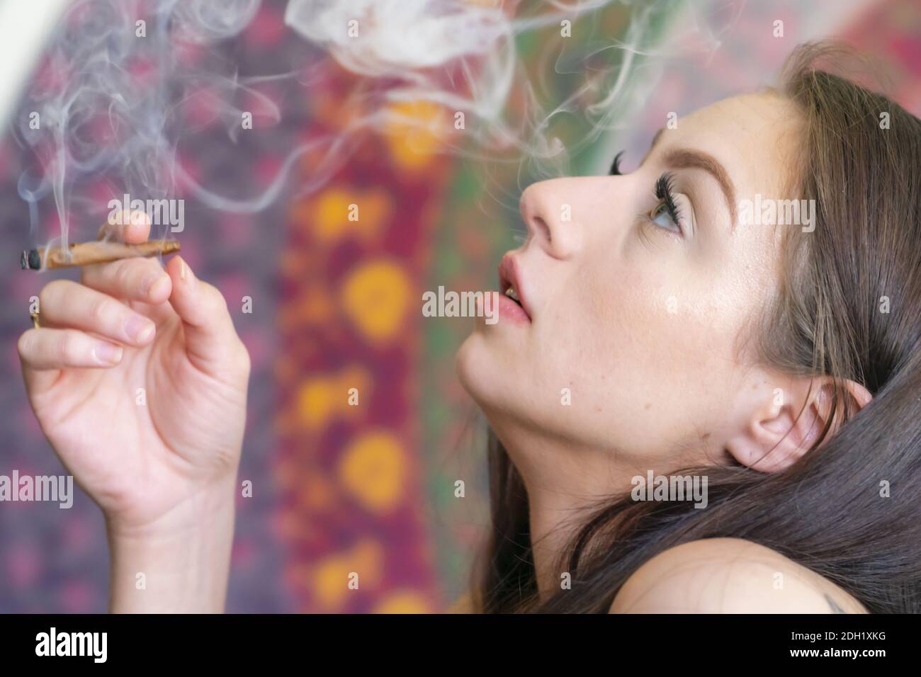 Young Brunette Model Smoking Marijuana Stock Photo - Alamy
